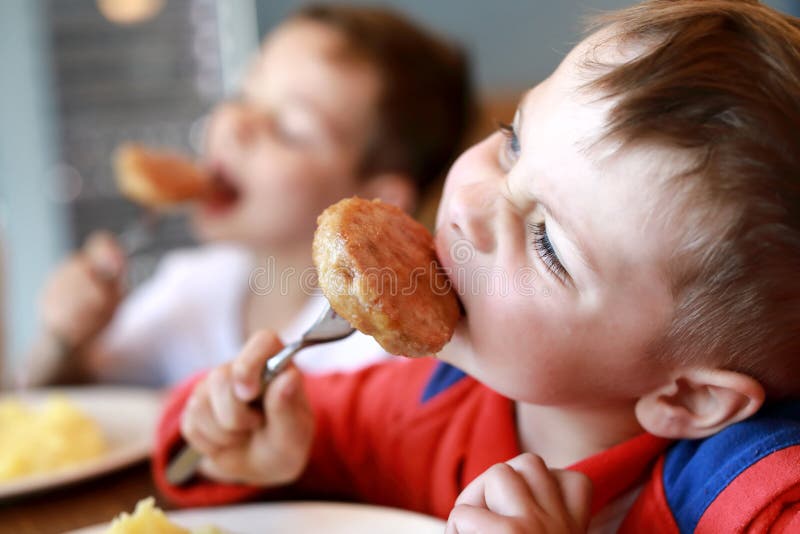 Two Brothers Eating Cutlets Stock Photo - Image of dish, cutlet: 153913538