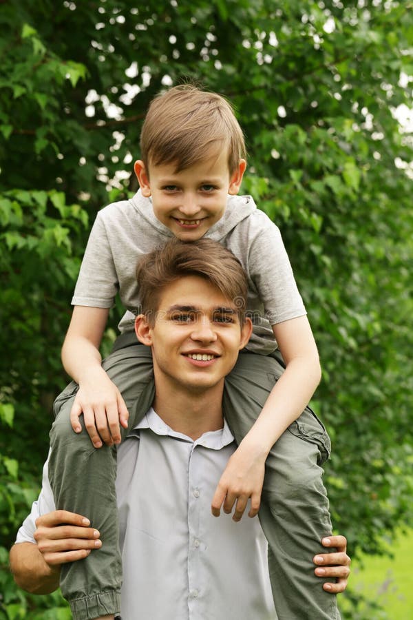 Two Brothers Have Fun in the Park - Summer Time Stock Photo - Image of ...