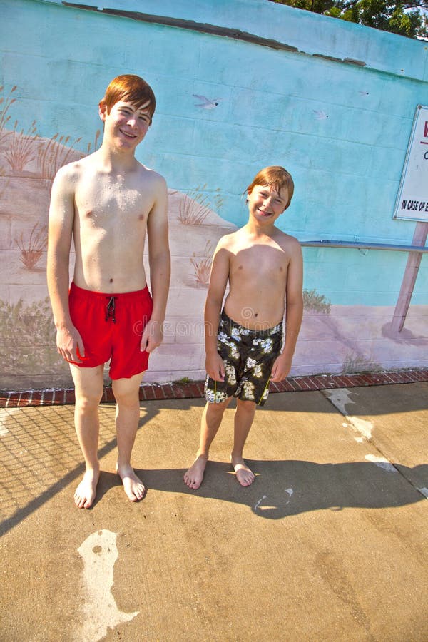 Two Brothers Having Fun in the Pool Stock Image - Image of adolescent ...