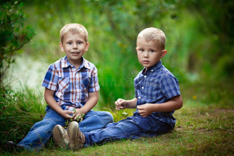 Two Brothers Hugging Each Other Outdoor Stock Image - Image of field ...