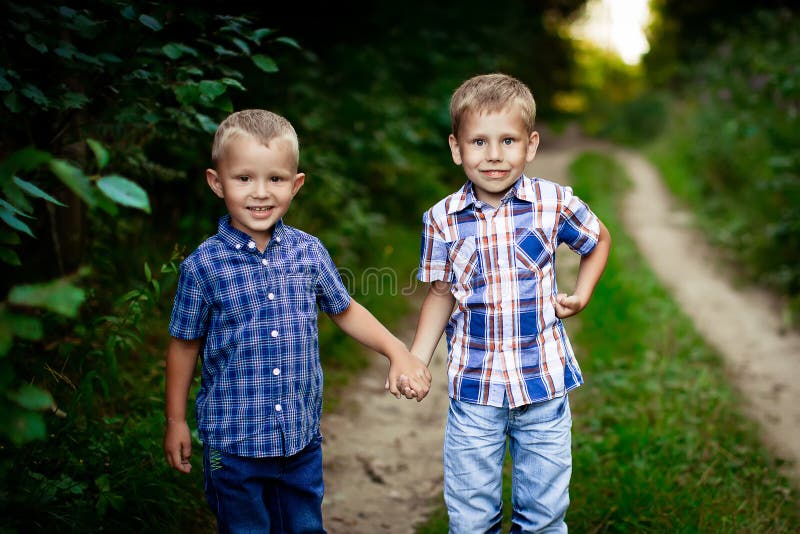 Two Brothers Hugging Each Other Outdoor Stock Image - Image of family ...