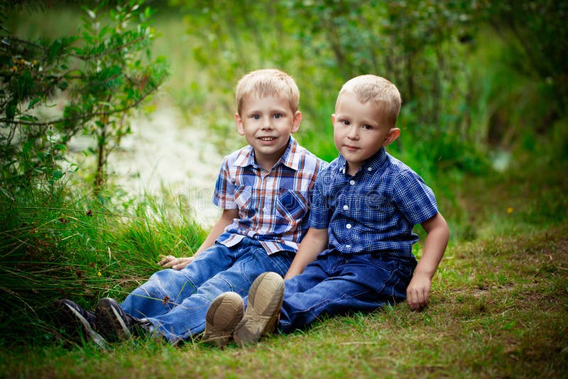 Two Brothers Hugging Each Other Outdoor Stock Image - Image of family ...