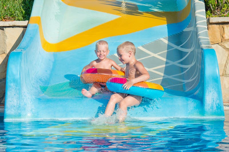 Two Brothers in an Inflatable Rubber Circles To Hold Hands and Move ...