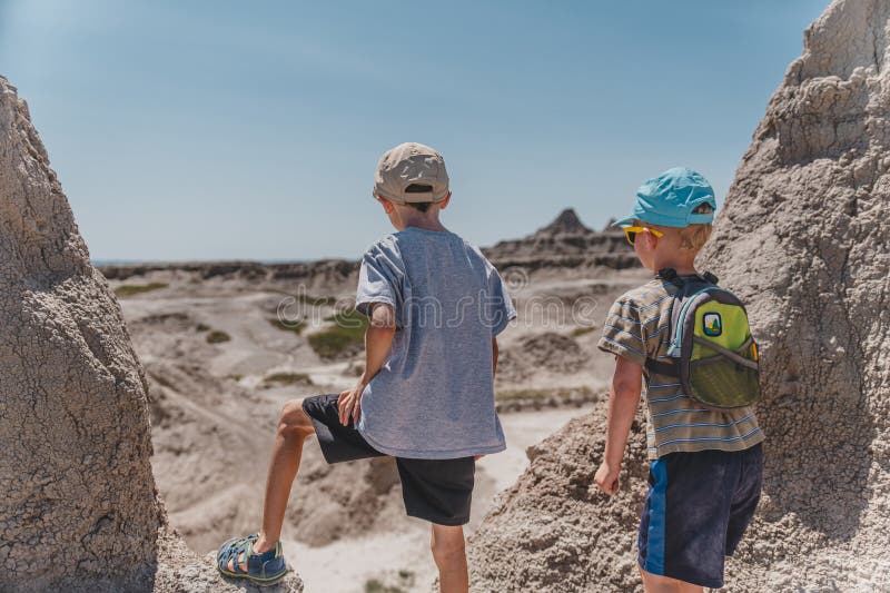 Two Brothers Looking Out at the Rock Formations of Badlands National ...