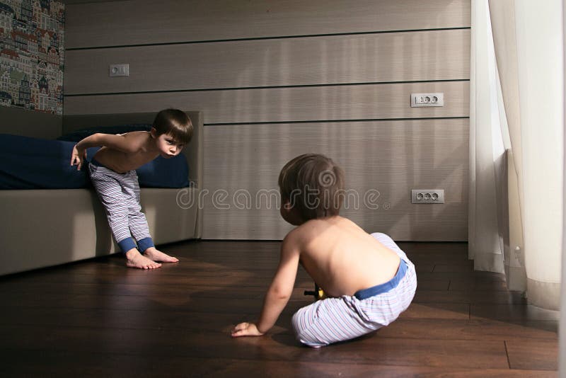 The Two Brothers are Against Each Other. Kids are Playing. Stock Photo ...