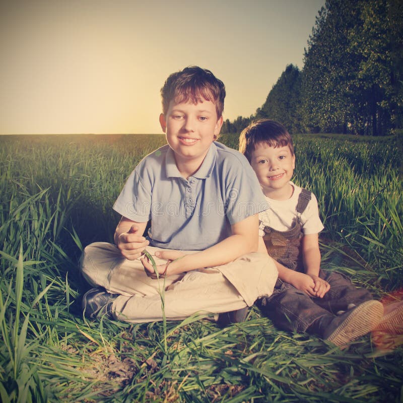 Two brothers outdoors stock image. Image of baby, handcarves - 37961445