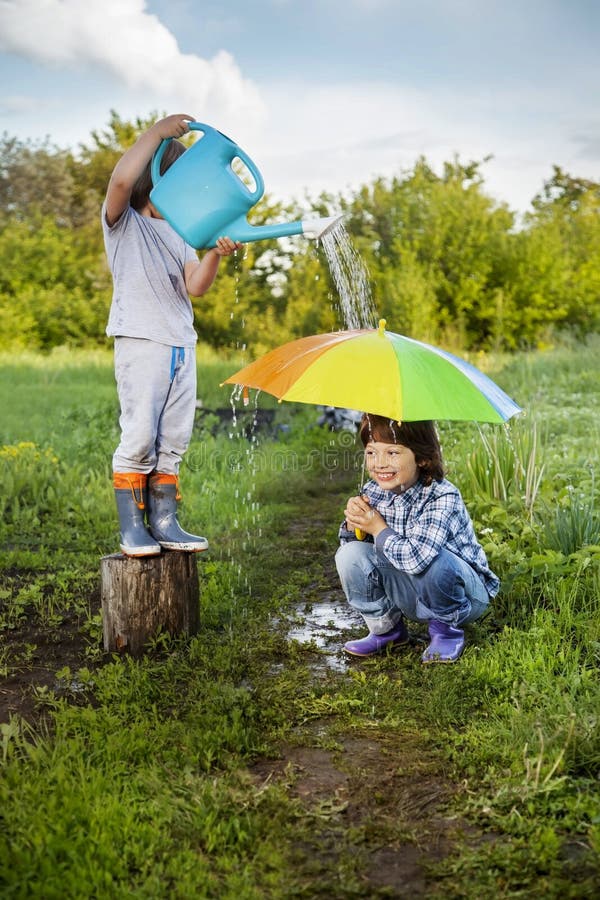 Two Boy Play in Rain Outdoors, Happy Brothers Game Stock Image - Image ...