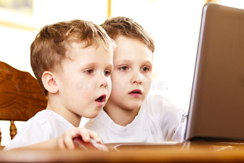 Kids Shocked by Something on Computer Stock Photo - Image of ...