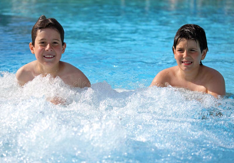 Two Brothers Playing in the Pool in Summer Stock Photo - Image of ...