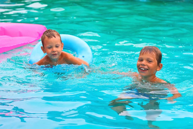 Two Brothers in Swimming Pool Stock Photo - Image of outdoors, face ...