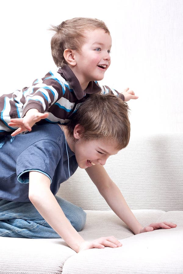 Two merry brothers hugging stock photo. Image of learner - 18874150