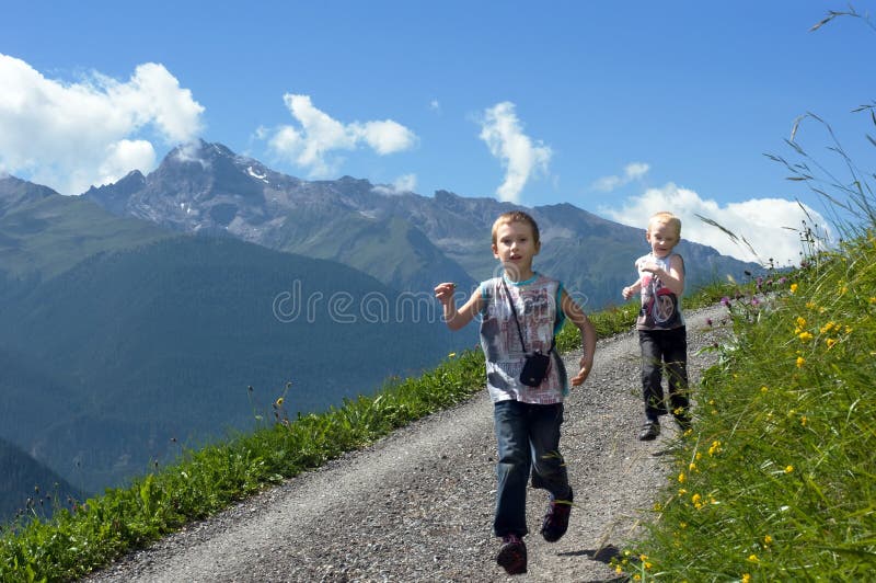 Two Brothers Running on Mountain Path Stock Photo - Image of climbing ...