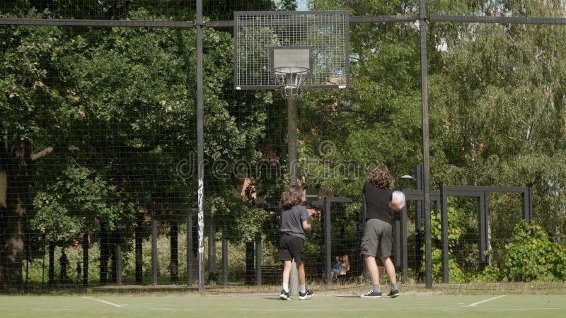 Two Brothers Shoot Hoops, Often Missing, but Keep Practicing with ...