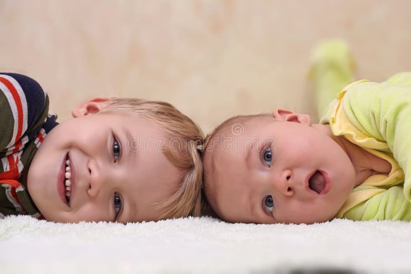 Two brothers smiling stock photo. Image of people, baby - 46104576