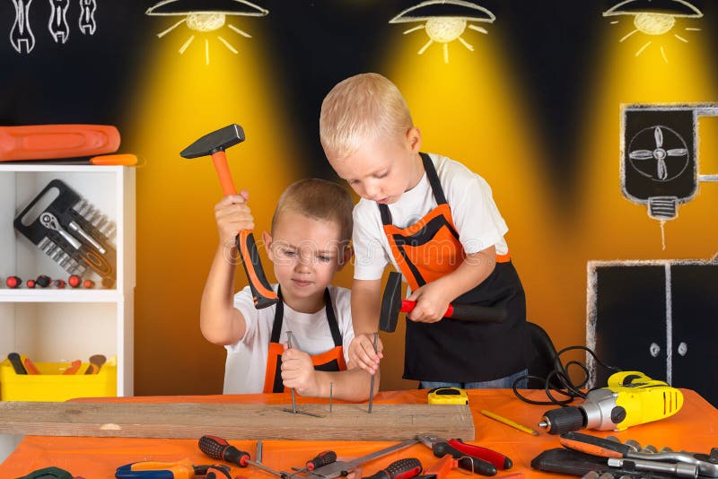 Brothers Working on Laptop Computer Sitting on Floor Stock Photo ...