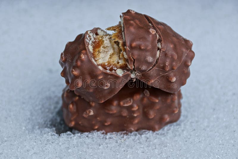 Two Brown Chocolate Bars are Lying on White Snow Stock Image - Image of ...