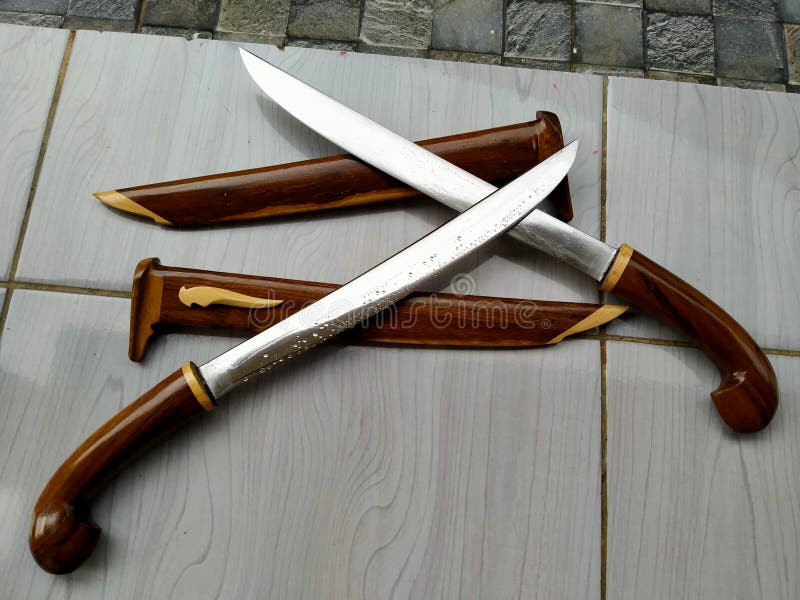 Two Brown Machetes Lying on a Ceramic House in Indonesia on 14-July ...