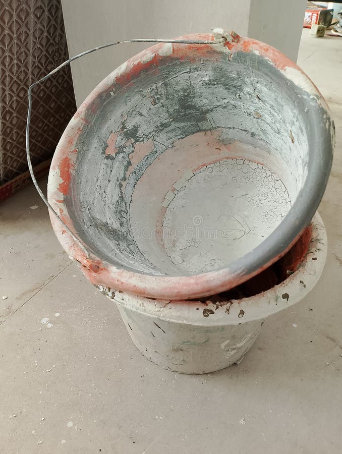 Two Buckets Piled Up and almost Falling Stock Photo - Image of falling ...