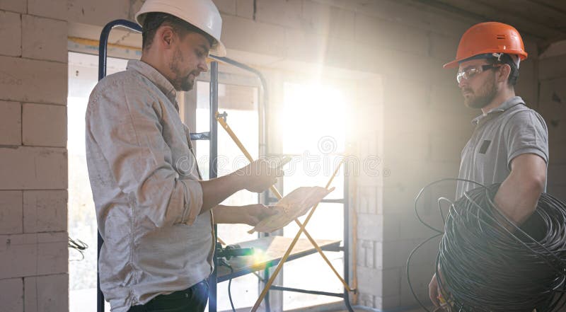 Two Builders Collaborate To Build a New Home Stock Image - Image of ...