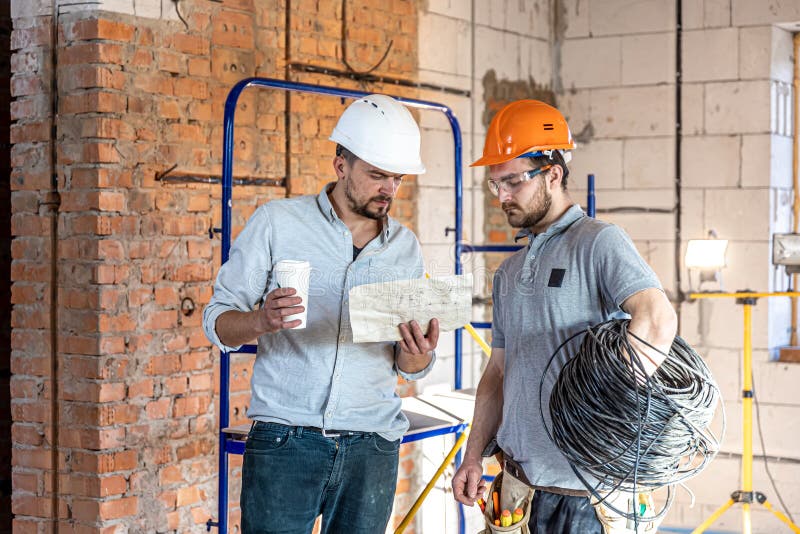 Two Builders Collaborate To Build a New Home Stock Photo - Image of ...