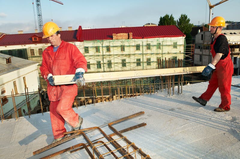 Two Builders at Construction Site Stock Image - Image of construction ...