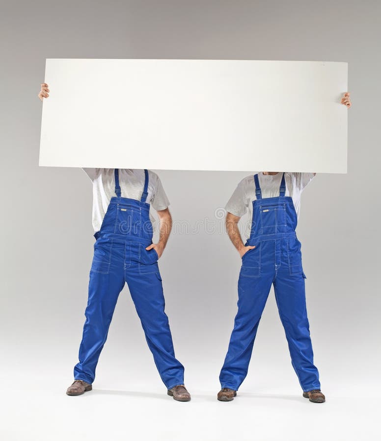 Two Builders Holding a Banner Stock Photo - Image of industrial, helmet ...