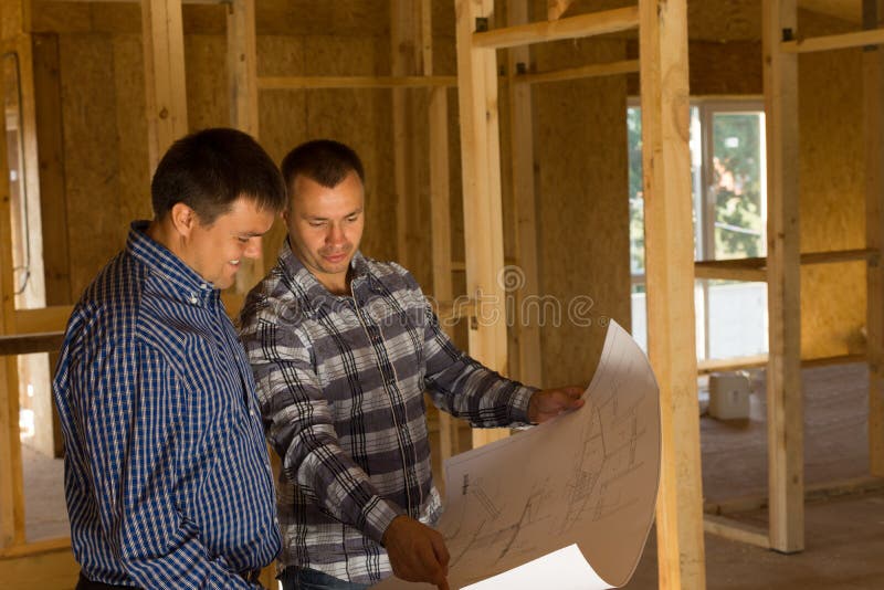 Two Builders Inside a Half Completed House Stock Photo - Image of ...