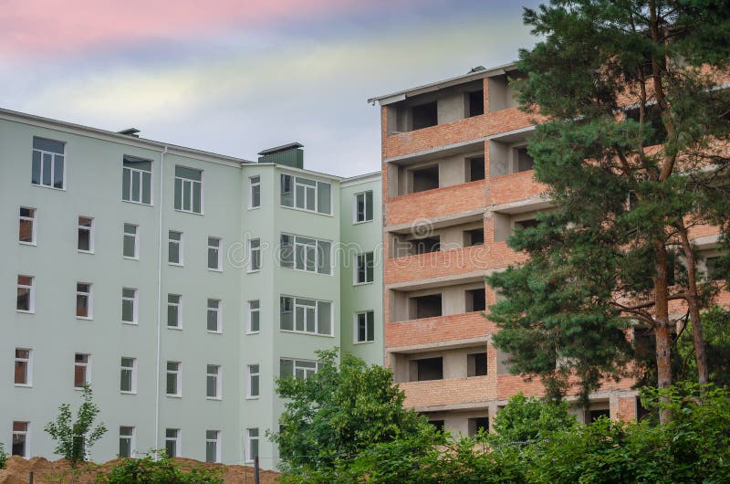 Two Buildings on the Construction Site. a Green Structure and an Stock ...