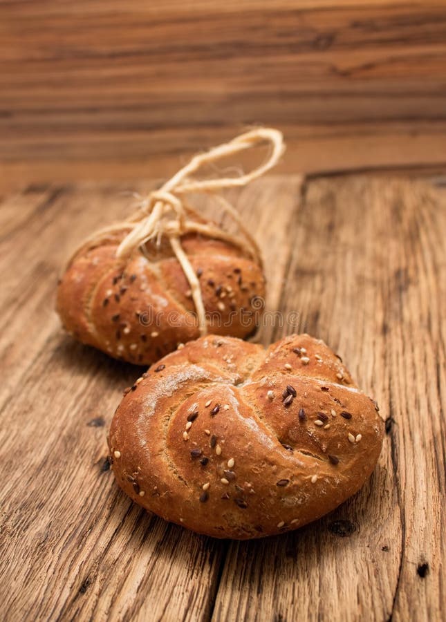 Two Buns on Worn Wooden Board Stock Image - Image of food, seed: 47657399