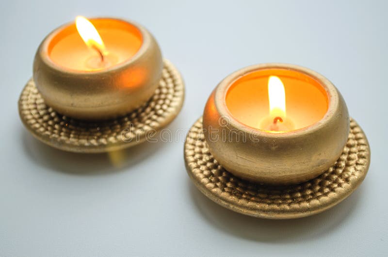 Two Burning Decorative Candles in Gold Color Stock Photo - Image of ...
