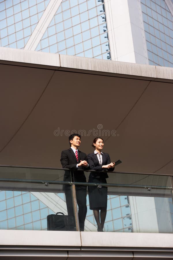 Two Business Colleagues Chatting Outside Stock Photo - Image of asia ...