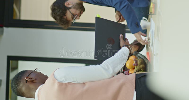 Two Business Colleagues Collaborate on a Project in a Modern Office ...