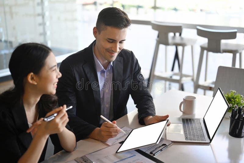 Two Business Colleagues Discussing Project Planning and Sharing Idea ...