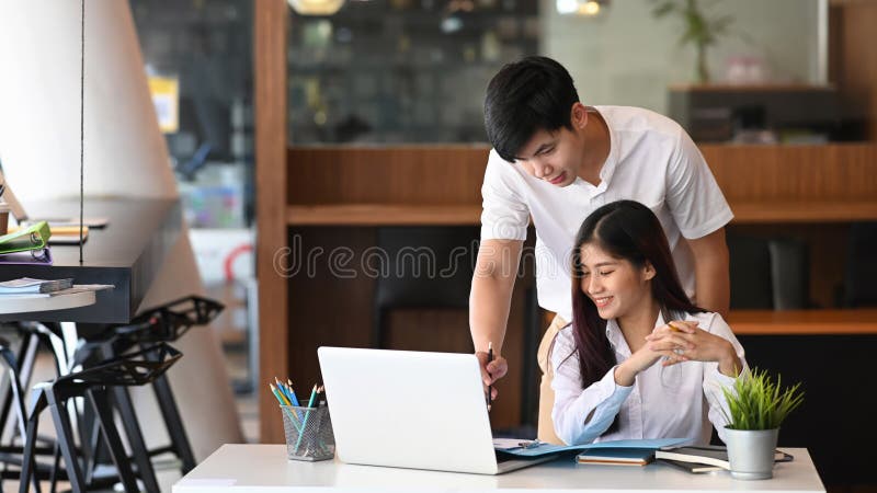 Two Business Colleagues Talking and Working Together in Office. Stock ...