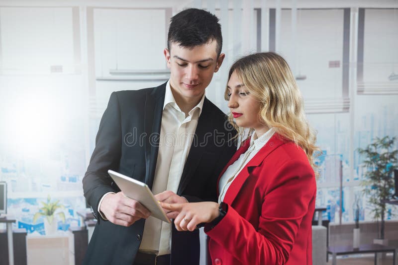 Two Business Colleagues Work at Office and Using Tablet Computer Stock ...