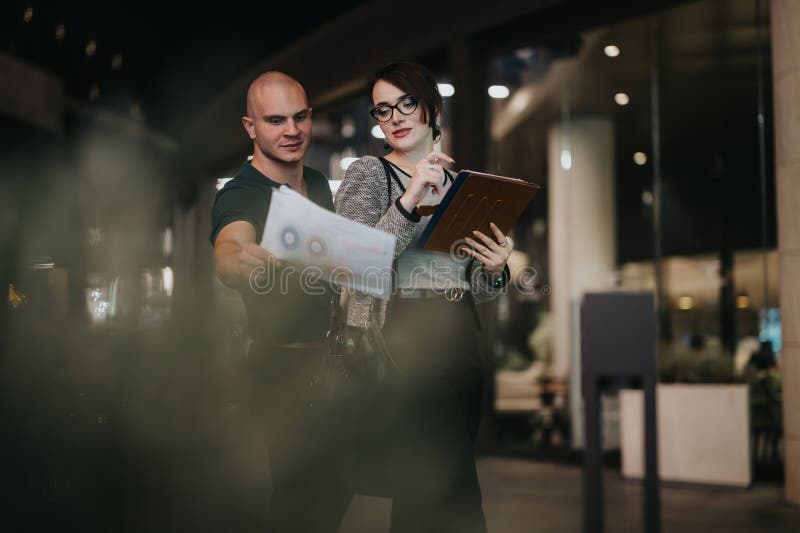 Two Business Colleagues Working on Project at Night in Modern Office ...