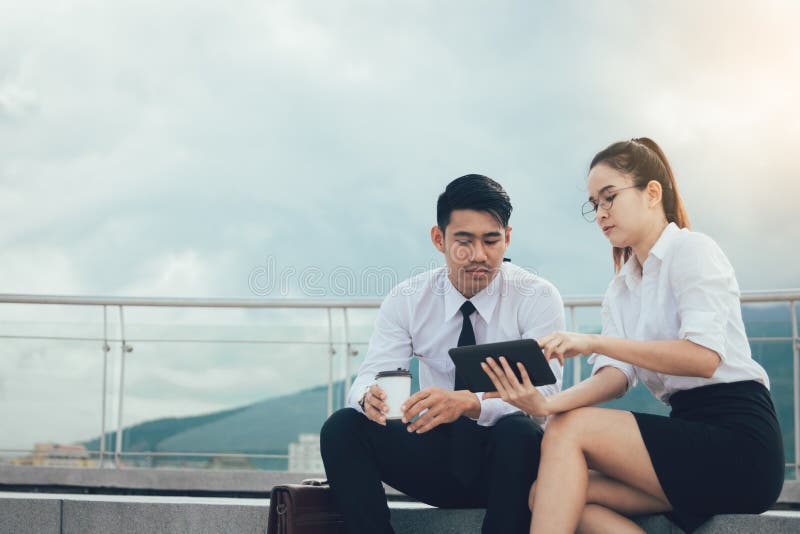 Two Business Couple Using Digital Tablet Working Together. Stock Image ...