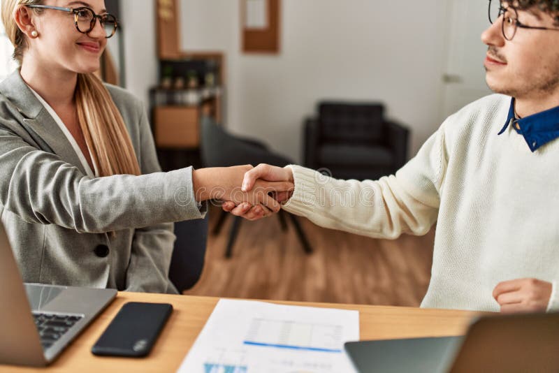 Two Business Executives Shaking Hands at the Office Stock Image - Image ...