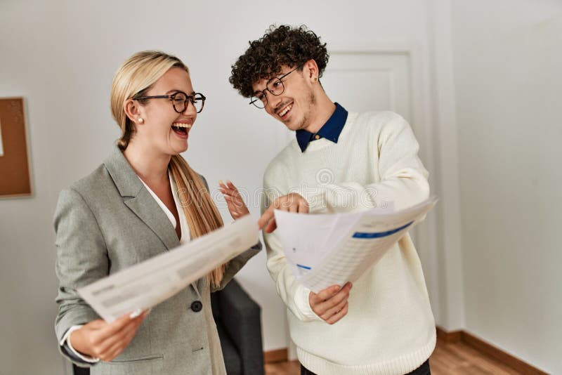 Two Business Executives Smiling Happy Working at the Office Stock Photo ...