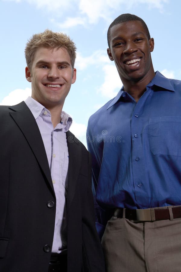 Two business men smiling stock photo. Image of associates - 2584466