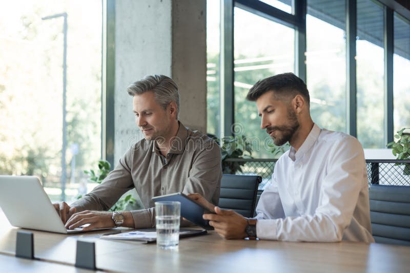 Two Business Men Talking To Each Other Discussing Their Business ...