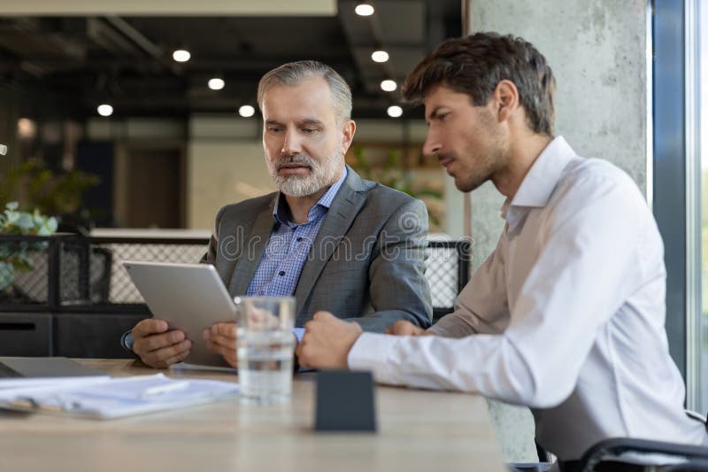 Two Business Men Talking To Each Other Discussing Their Business ...