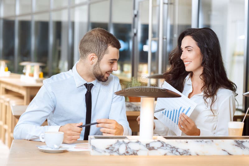 Two Business Partners Discussing Diagram Report Stock Image - Image of ...