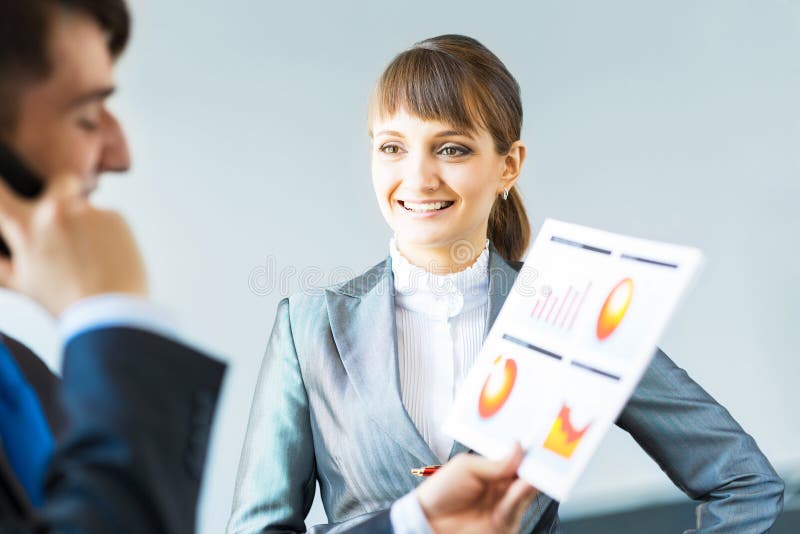 Two Business Partners Discussing Reports Stock Photo - Image of ...