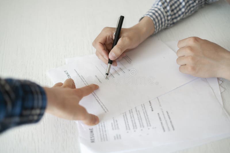 The Two Business Partners Sitting at the Table and Sign the Agreement ...
