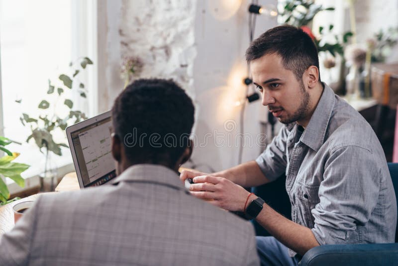 Two Business Partners Working with Laptop Together. Stock Image - Image ...