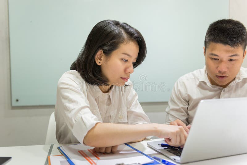 Two Business People Discuss about Work in Office Stock Photo - Image of ...