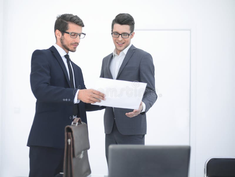 Two Business People Discussing a Business Document Stock Image - Image ...