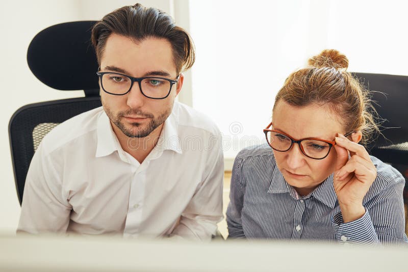 Two Business People Discussing Financial Data Looking at Computer ...