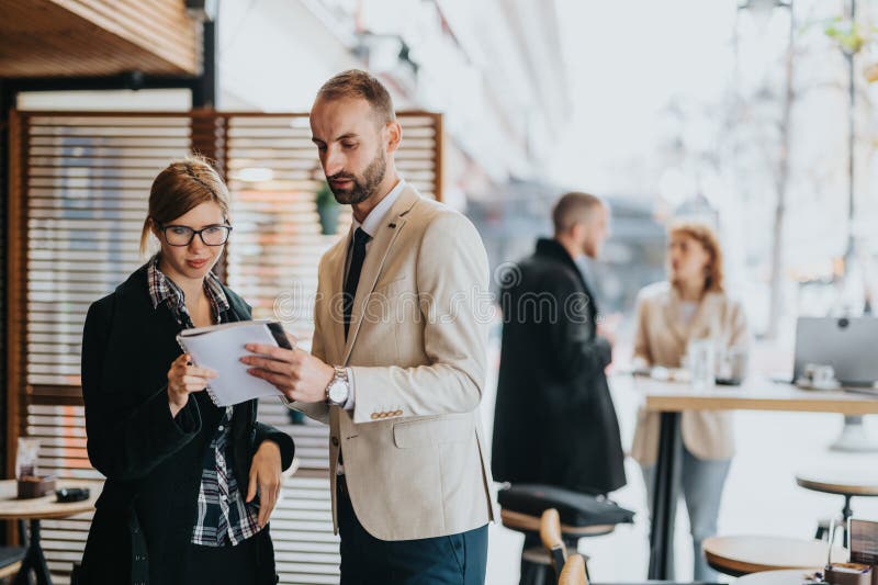 Business Professionals Brainstorming Outdoors in a Casual Urban Setting ...
